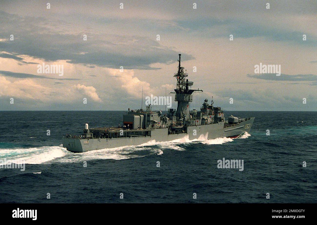 A starboard quarter view of the frigate USS REASONER (FF-1063) underway ...