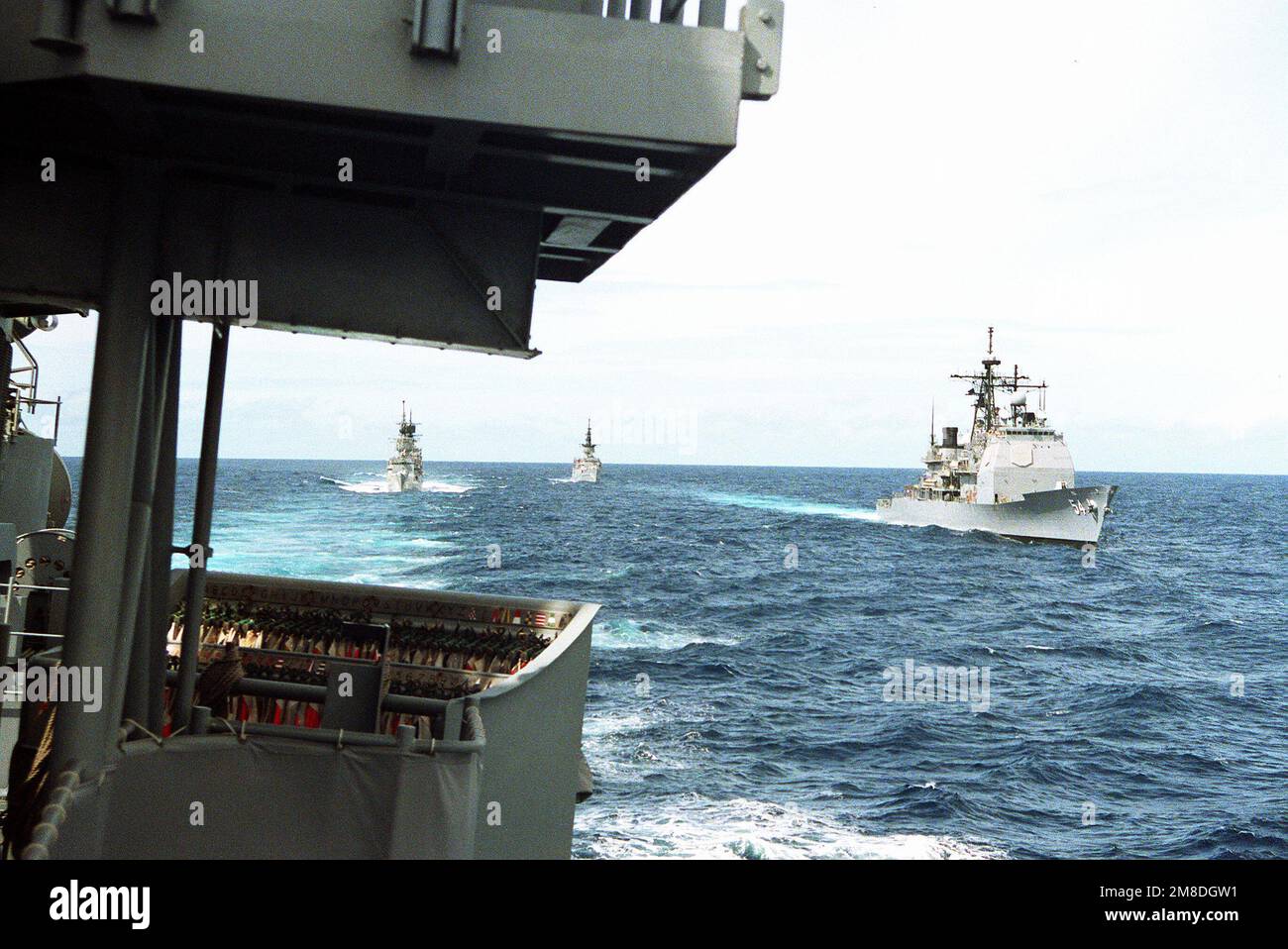 Underway north of Diego Garcia are the frigates USS BREWTON (FF-1086 ...