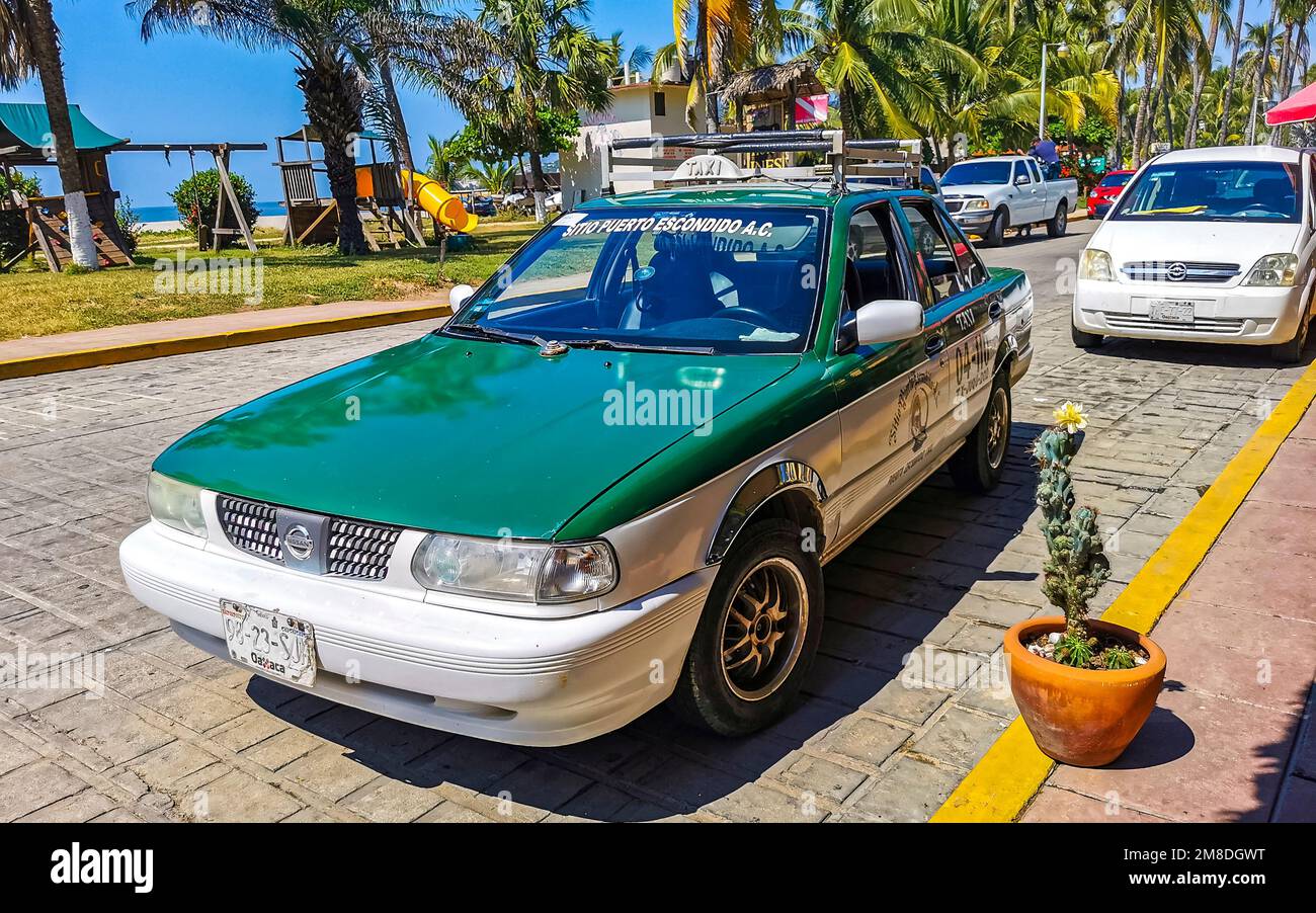 Colorful green turquoise blue orange taxi cab car in Puerto Escondido ...