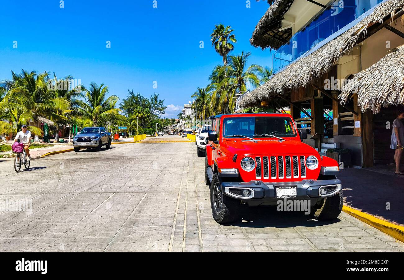 Colorful streets cars high traffic stores people buildings and trade in ...