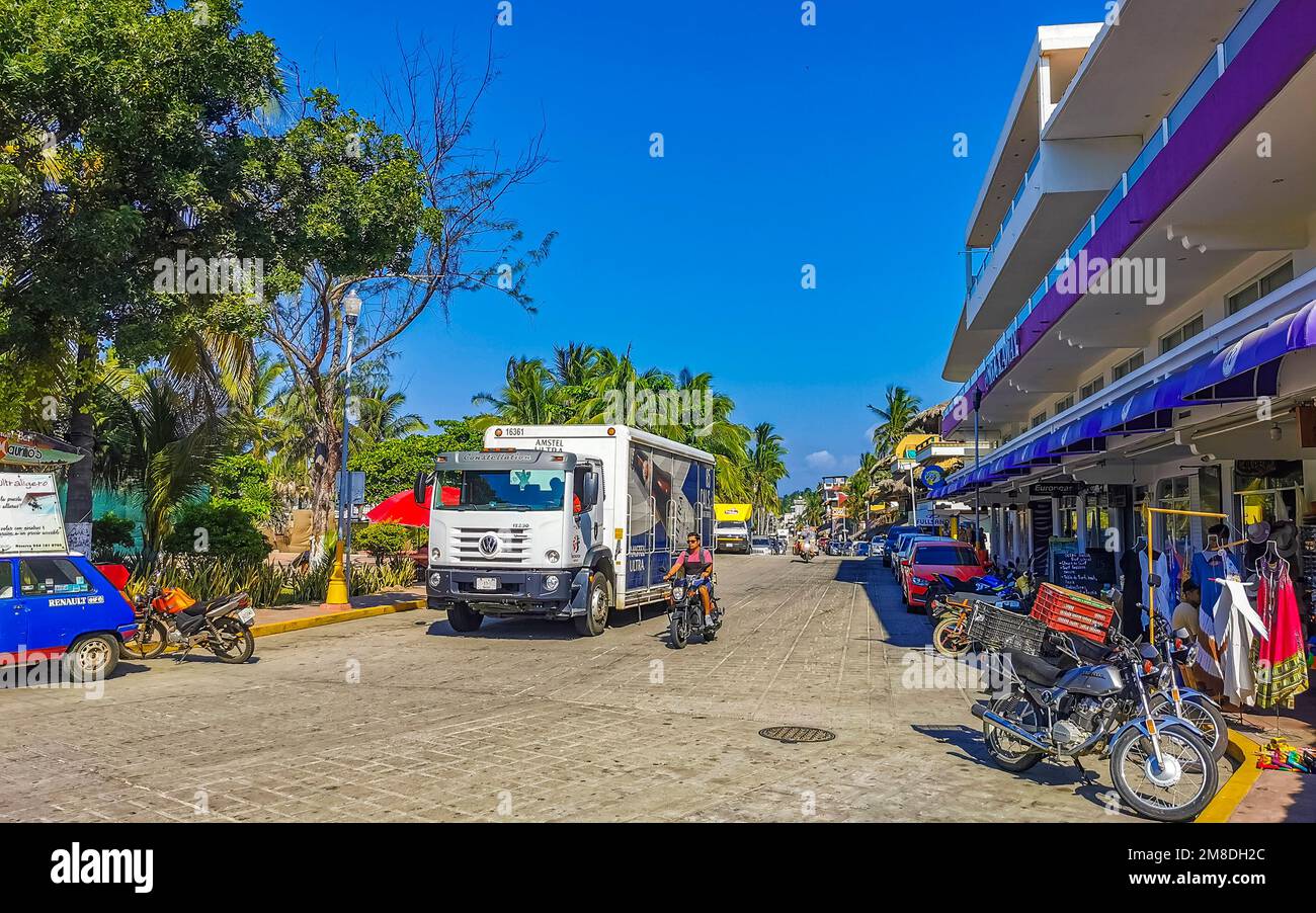 Colorful streets cars high traffic stores people buildings and trade in ...