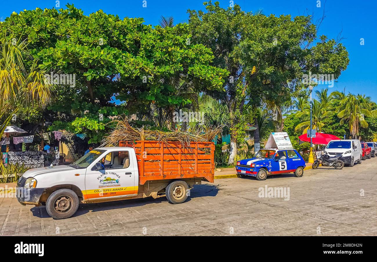 Colorful streets cars high traffic stores people buildings and trade in ...