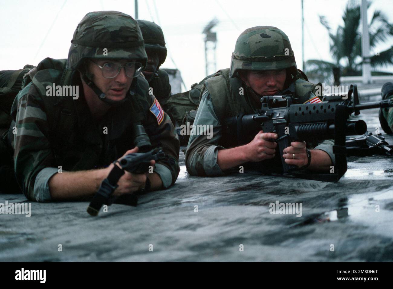 A group of Marines stand watch on the roof of the United States Embassy ...