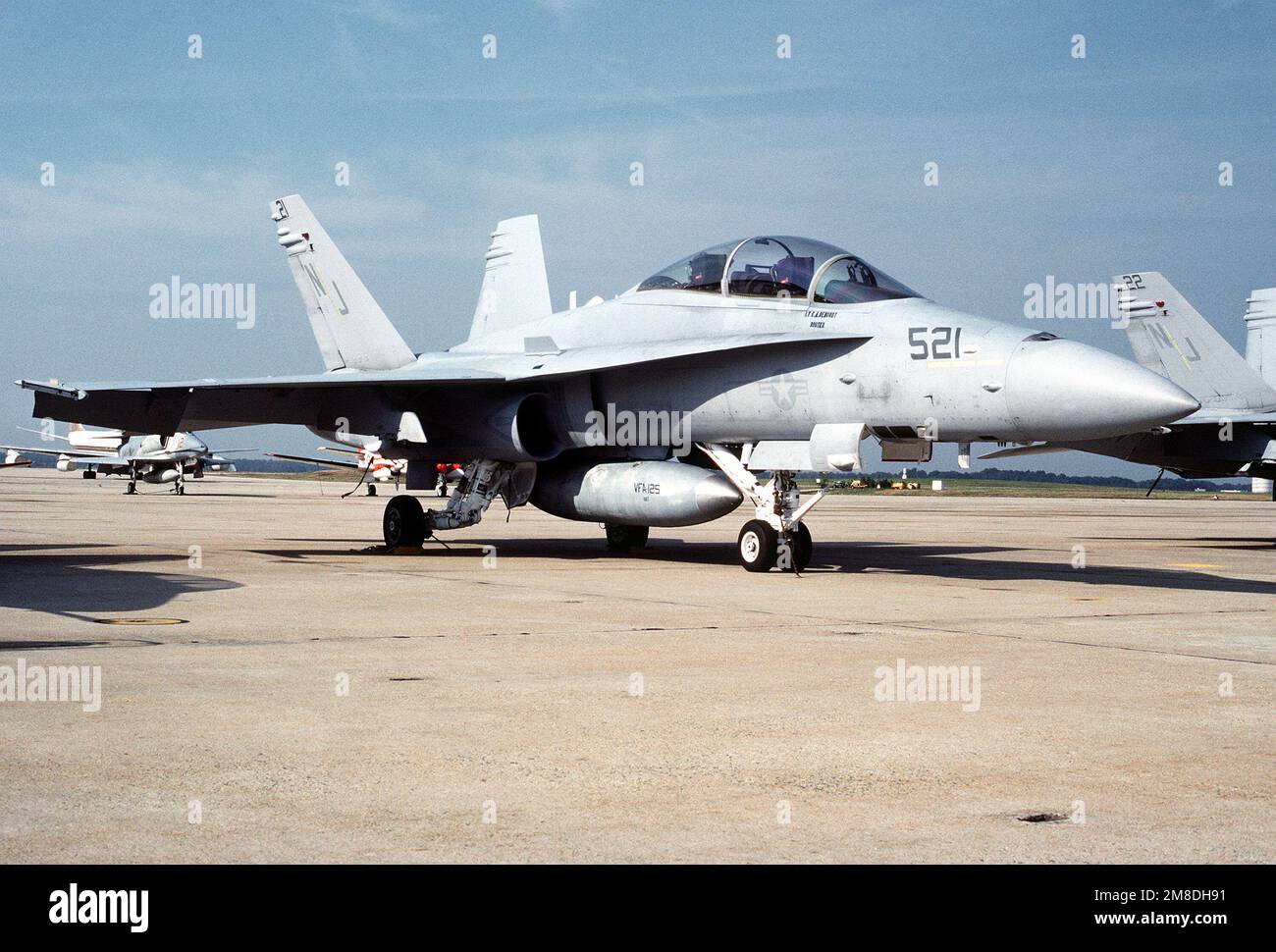 A right front view of a Strike-Fighter Squadron 125 (VFA-125) F/A-18D Hornet aircraft parked on ...