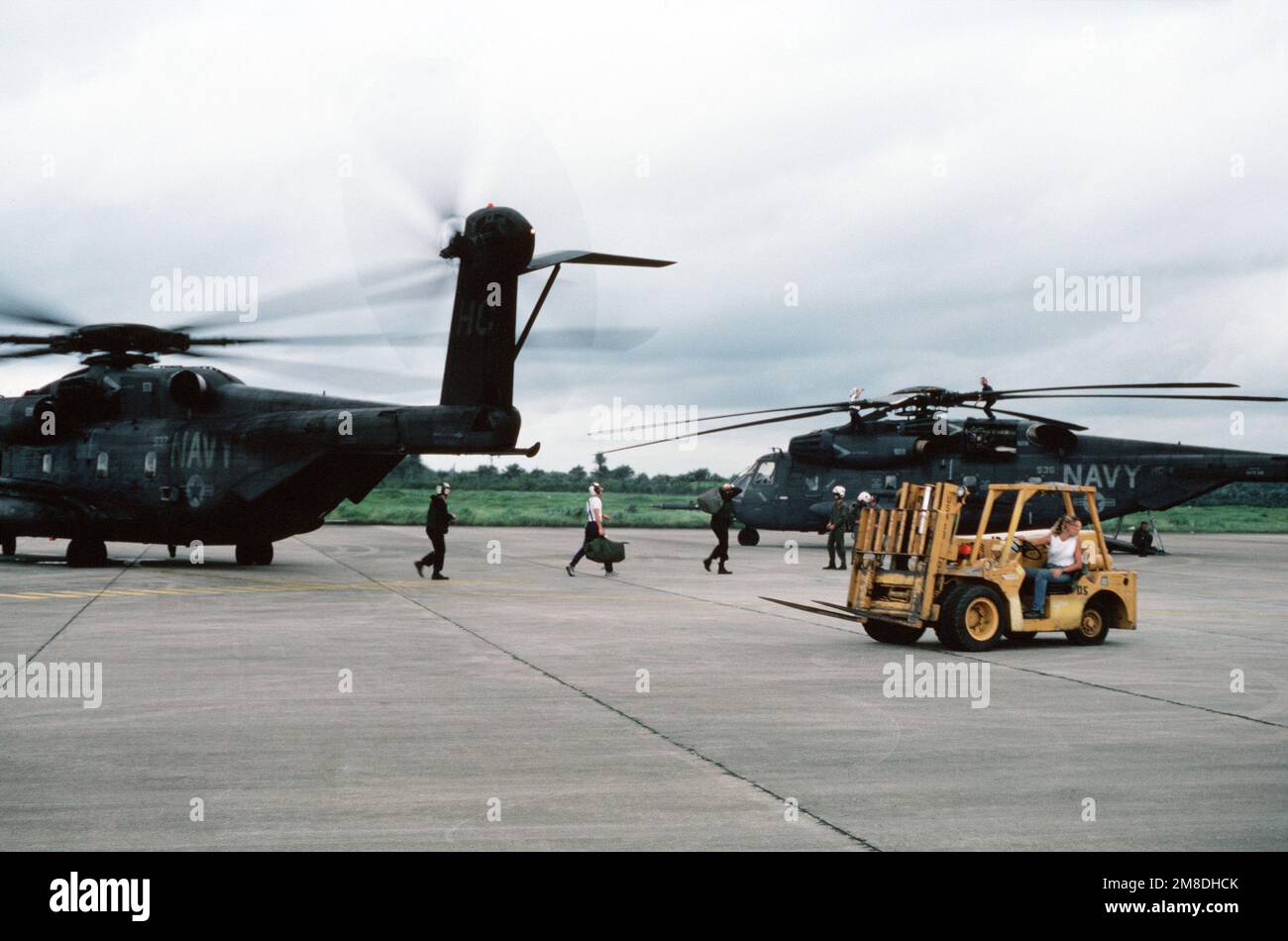 A forklift stands by to transport cargo from a Helicopter Combat ...