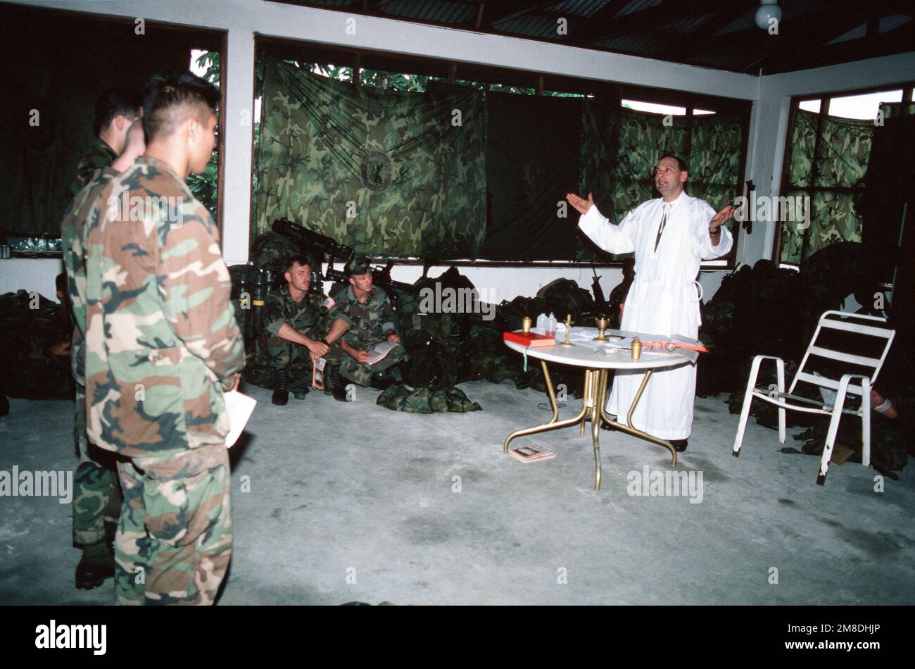 A U.S. Marine attends Mass at the American Embassy during Operation ...