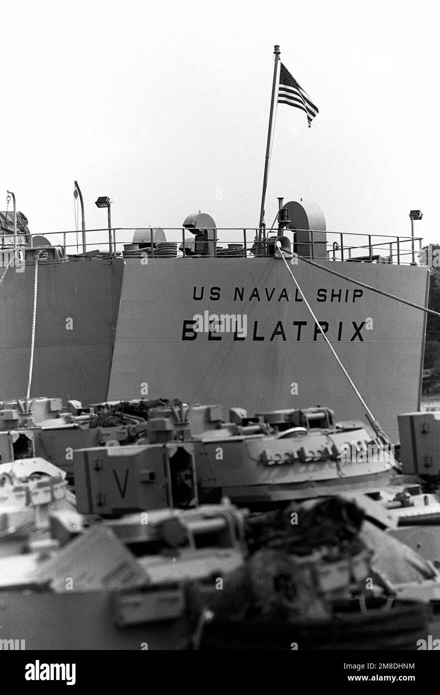Equipment is lined on the pier in preparation for loading aboard the ...