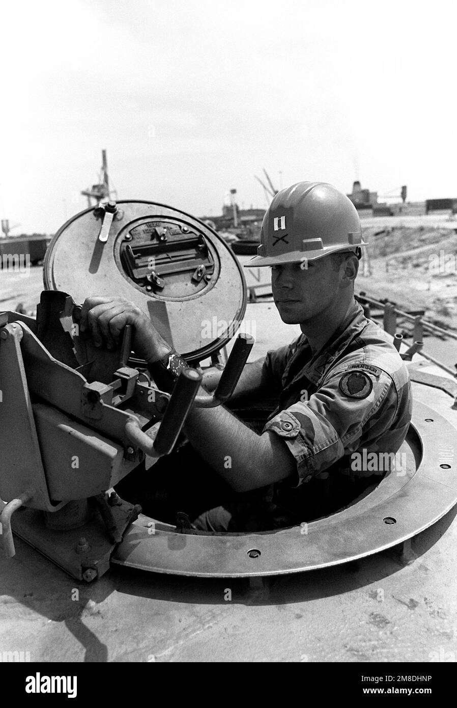 A U.S. Army officer sits in the hatch of an M-1 Abrams main battle tank ...