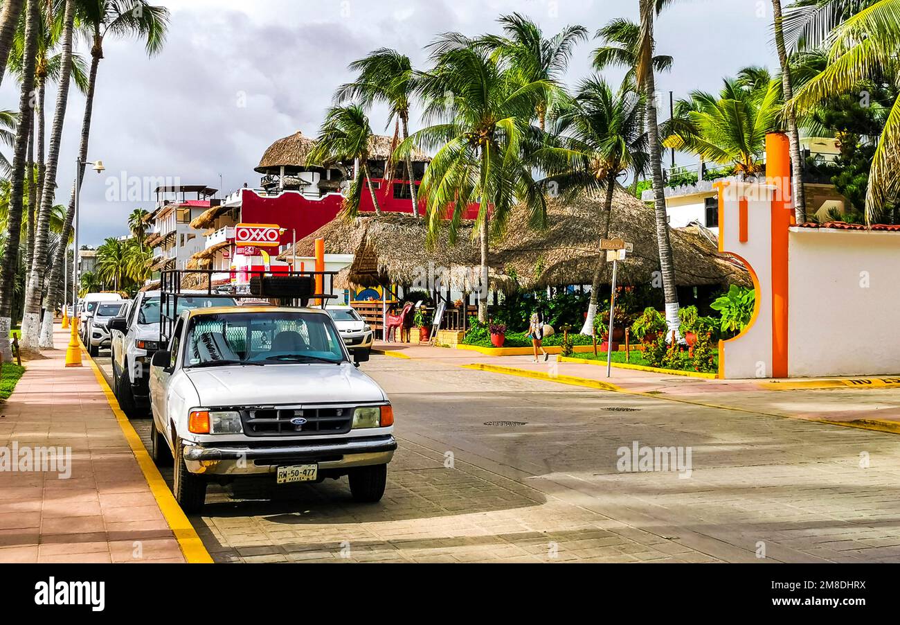 Colorful streets cars high traffic stores people buildings and trade in ...