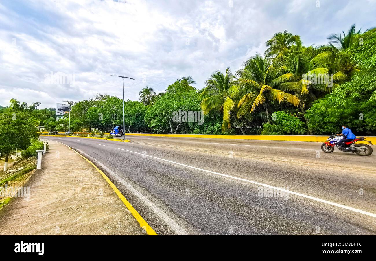 Colorful streets cars high traffic stores people buildings and trade in ...