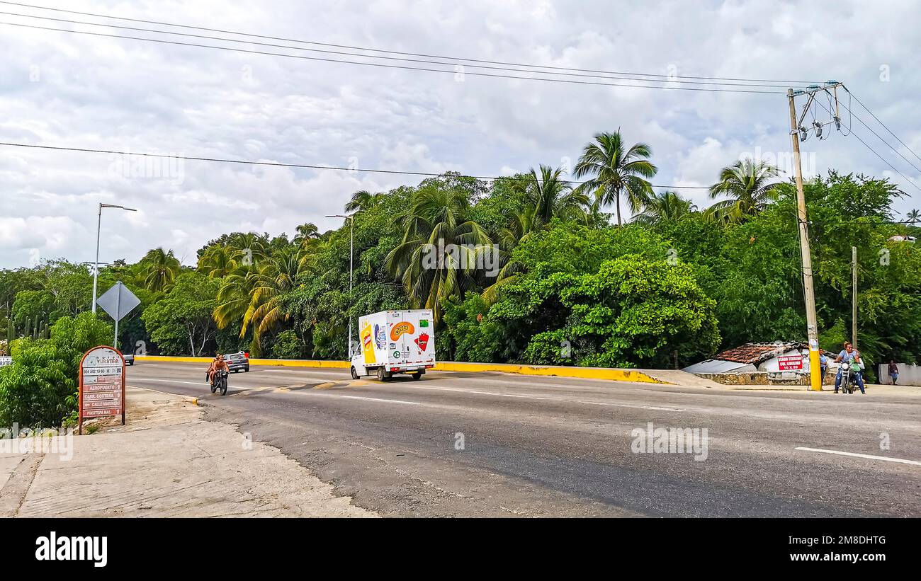 Colorful streets cars high traffic stores people buildings and trade in ...