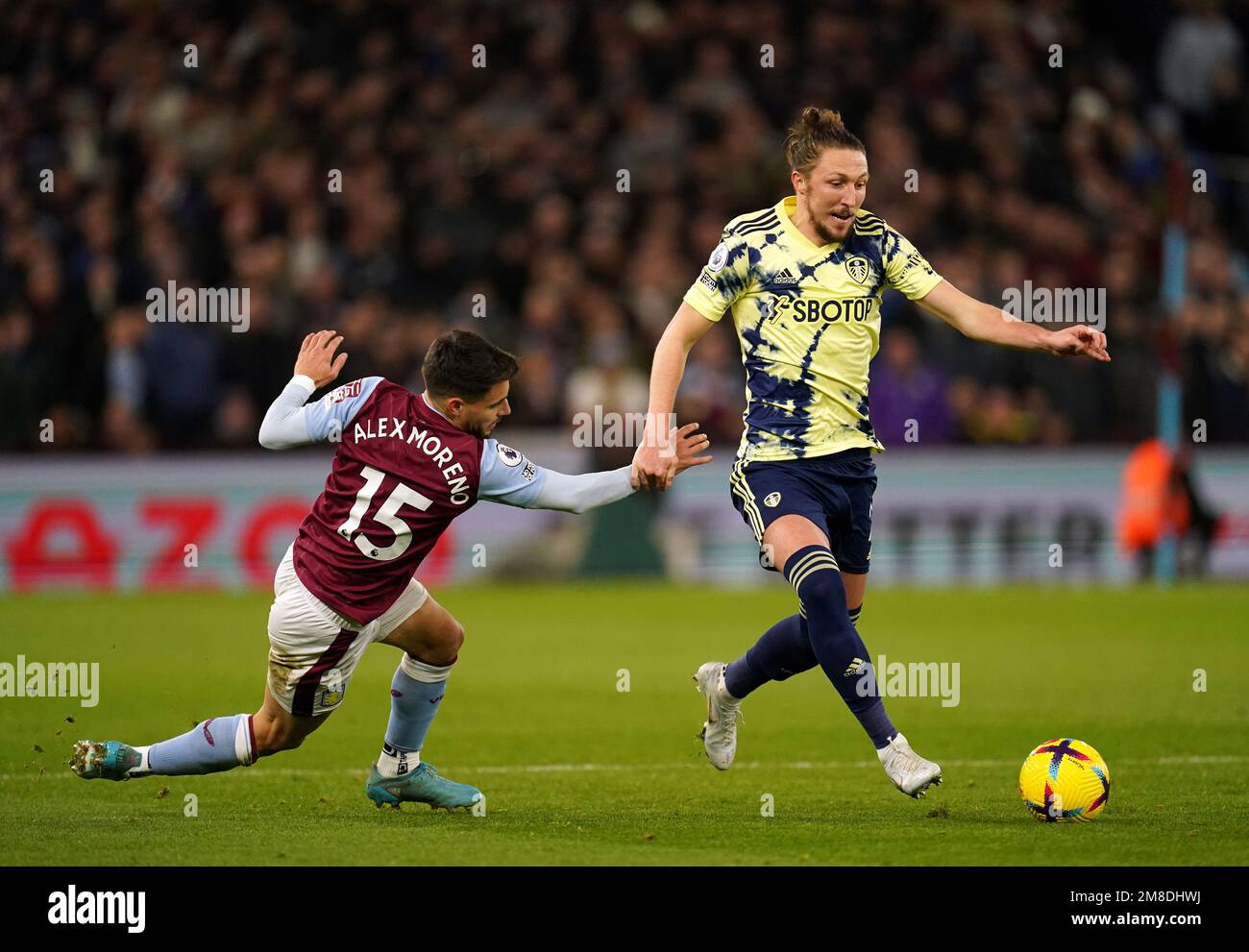 Leeds United's Luke Ayling (right) gets past Aston Villa's Alex Moreno ...