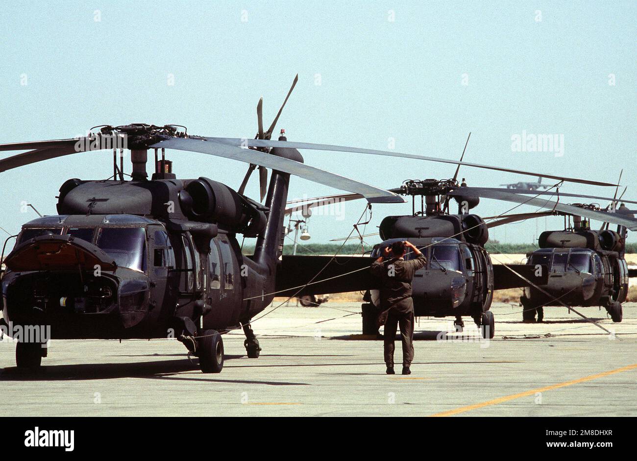 A soldier begins a preflight check on a UH-60 Black Hawk (Blackhawk ...