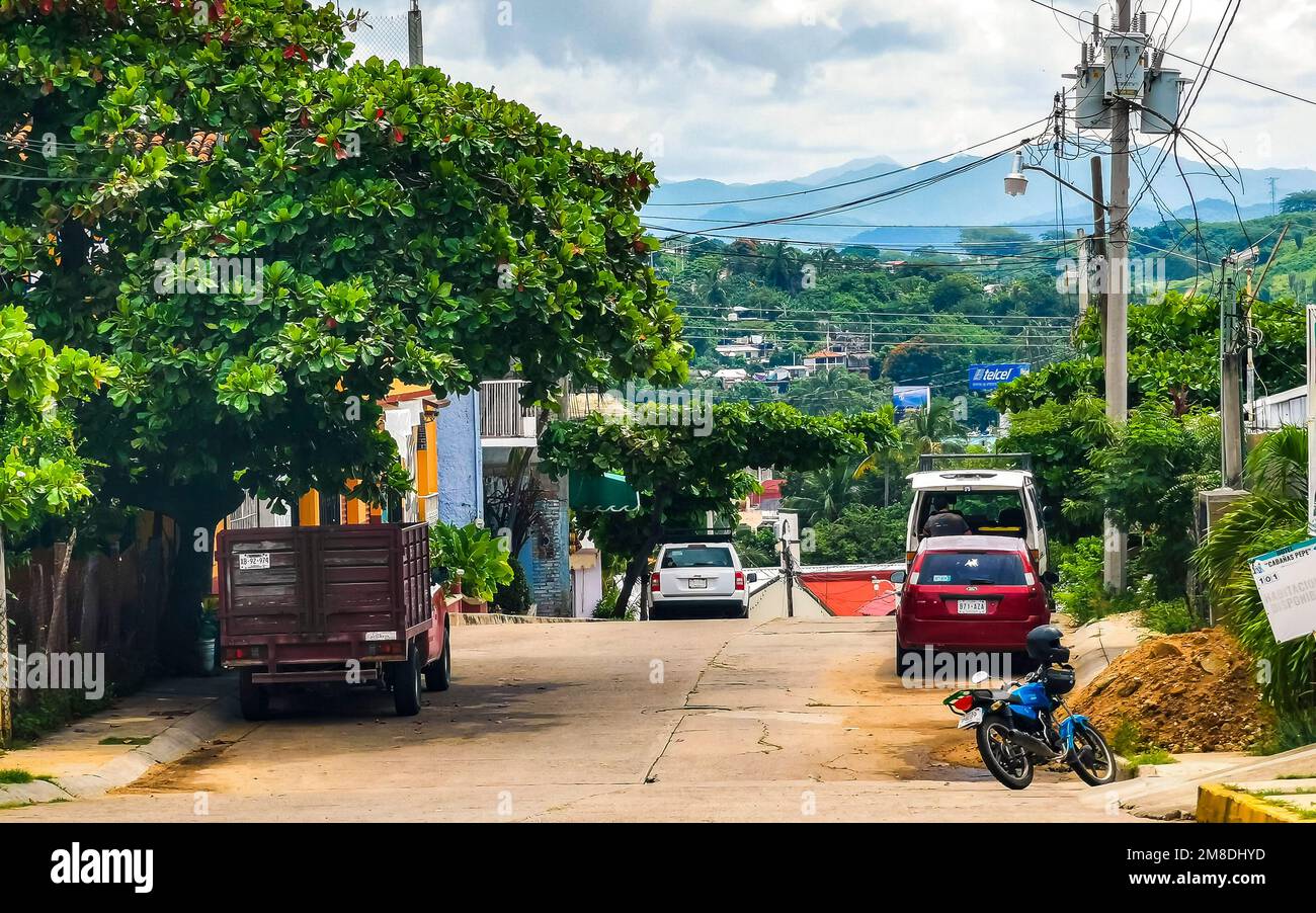 Colorful streets cars high traffic stores people buildings and trade in ...