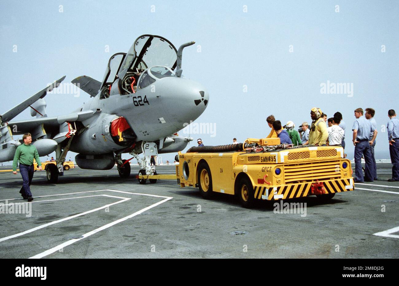 Flight deck personnel aboard the nuclear-powered aircraft carrier USS ...