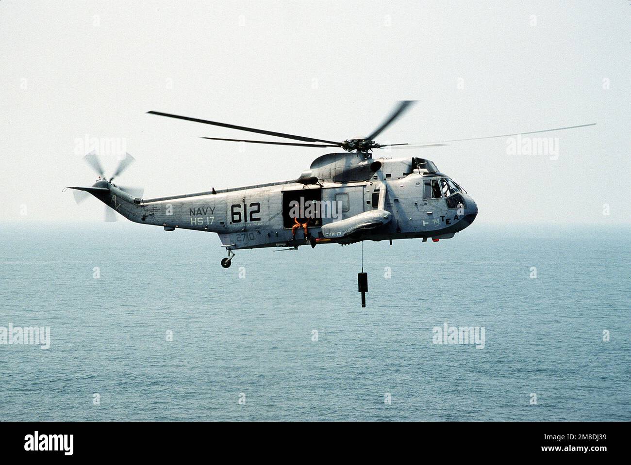 A Helicopter Anti-submarine Squadron 17 (HS-17) SH-3H Sea King ...