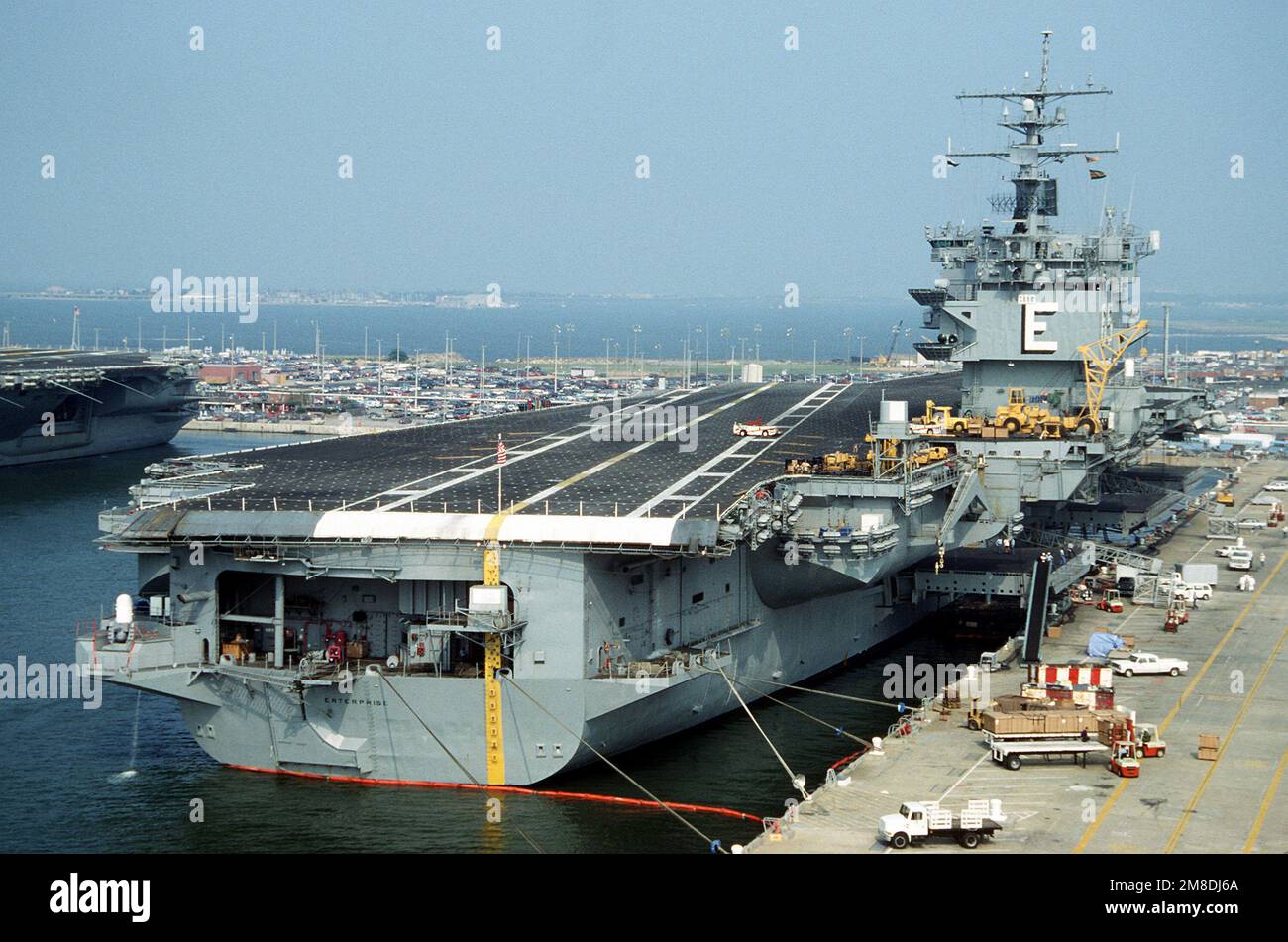 A starboard quarter view of the nuclear-powered aircraft carrier USS ...