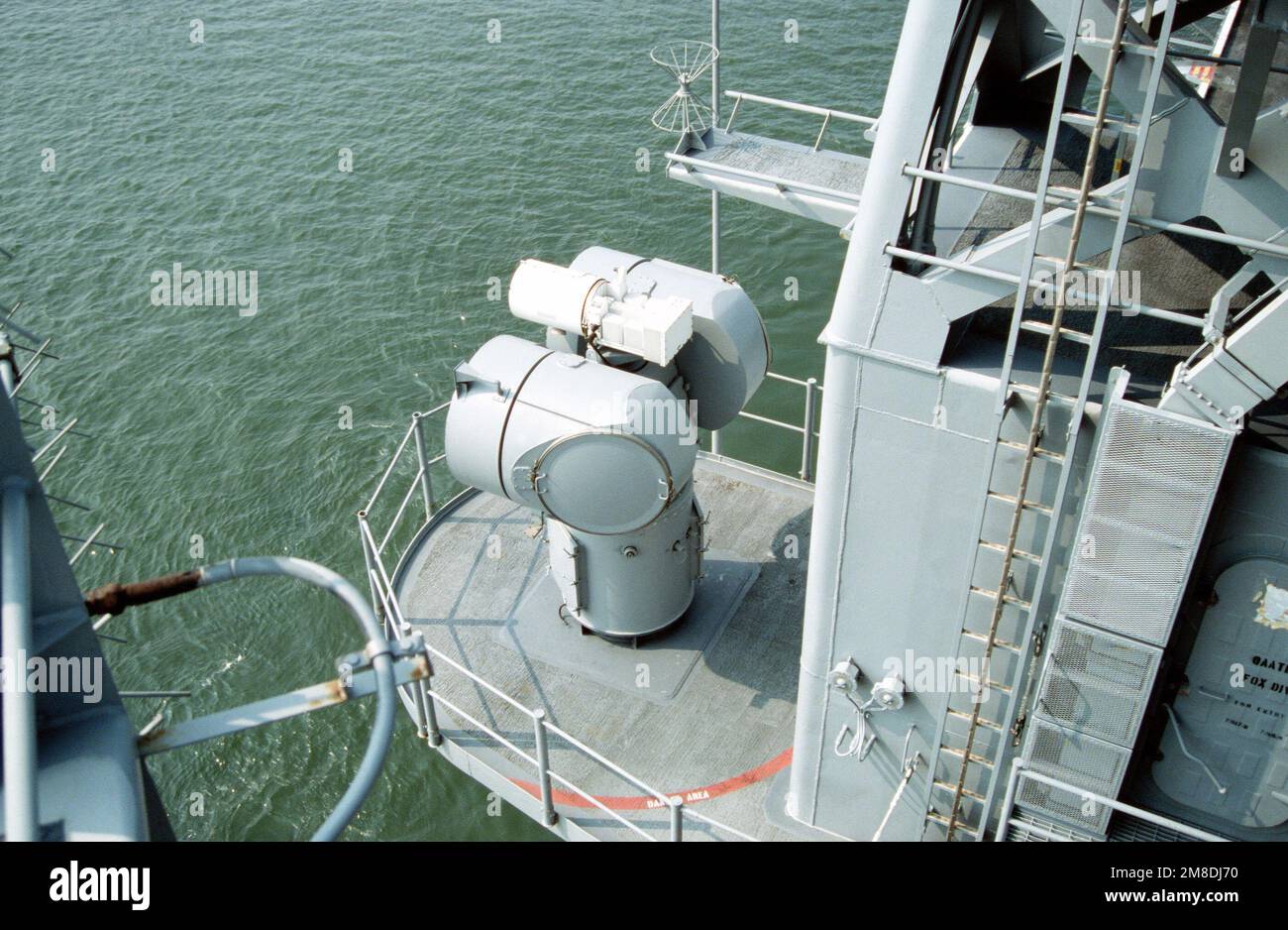 A view of a Mark 91 fire control system mounted on the lattice mast ...