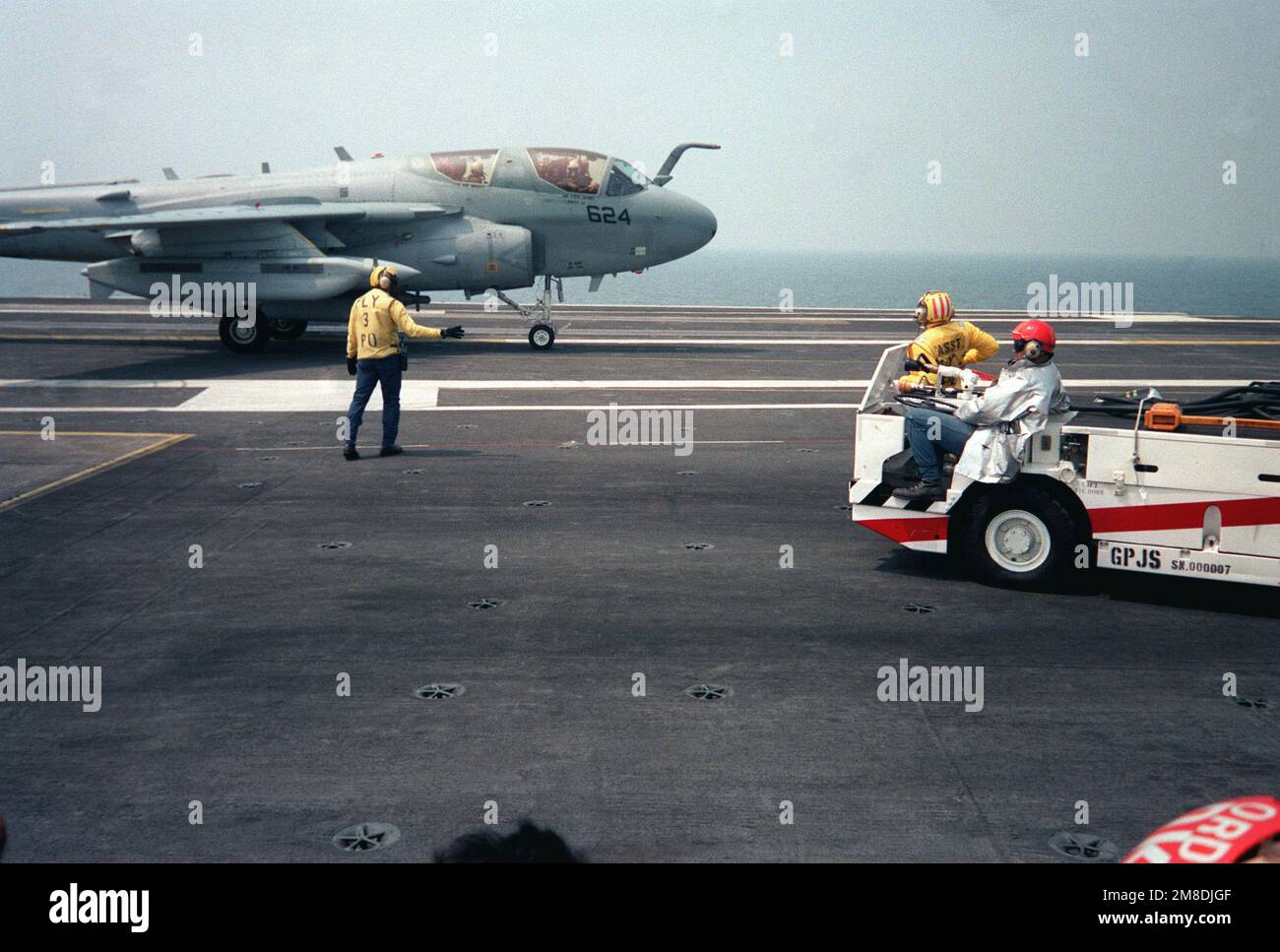 A firefighter in a crash and rescue vehicle stands by following the ...