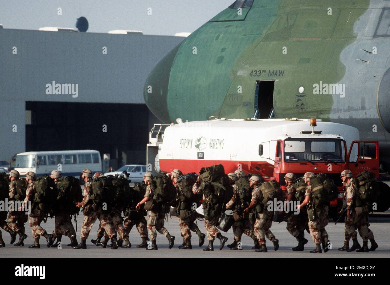 U.S. military personnel arrive at Dhahran International Airport aboard ...