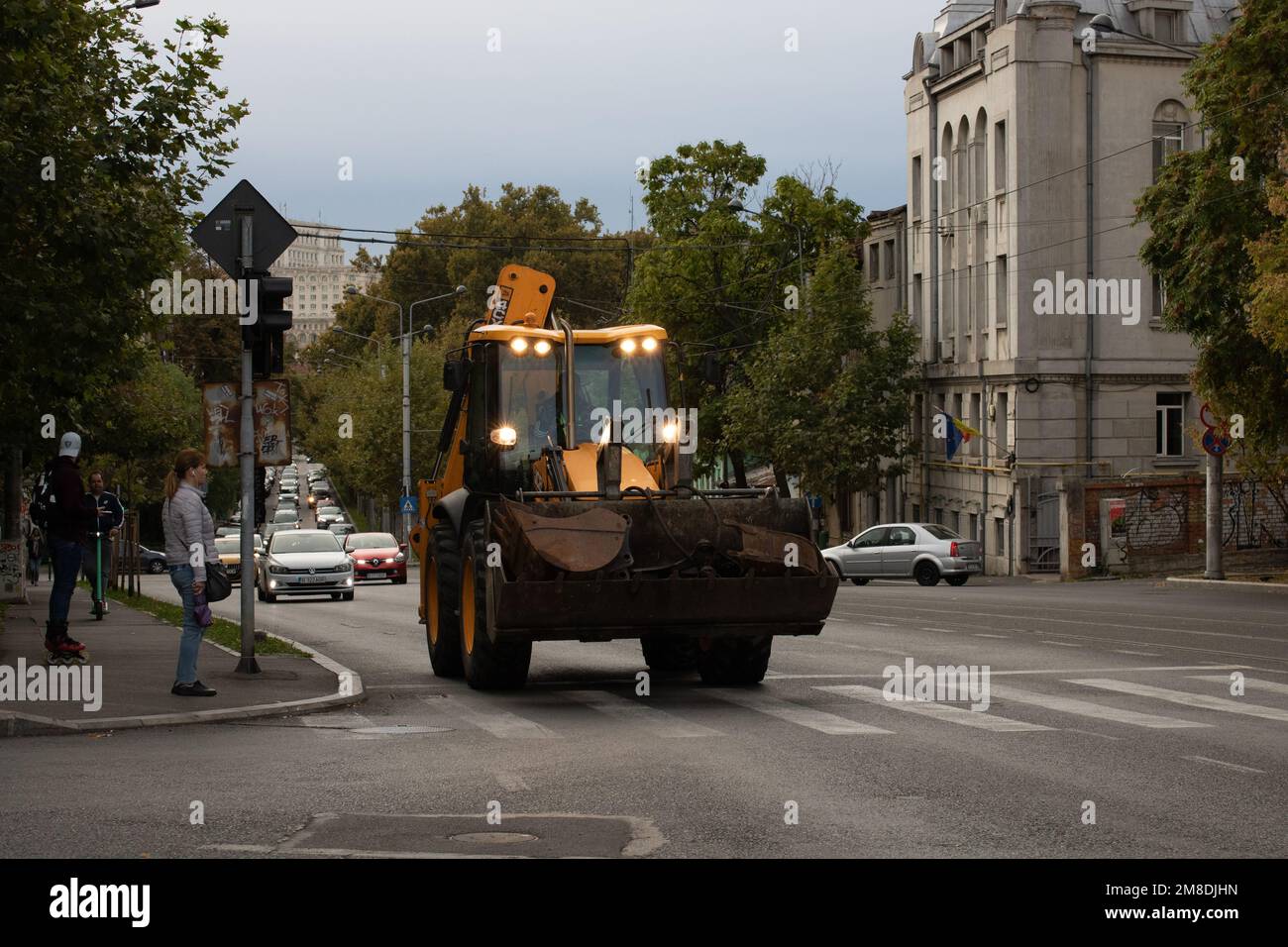 Construction workers at construction site and heavy duty bulldozer in ...