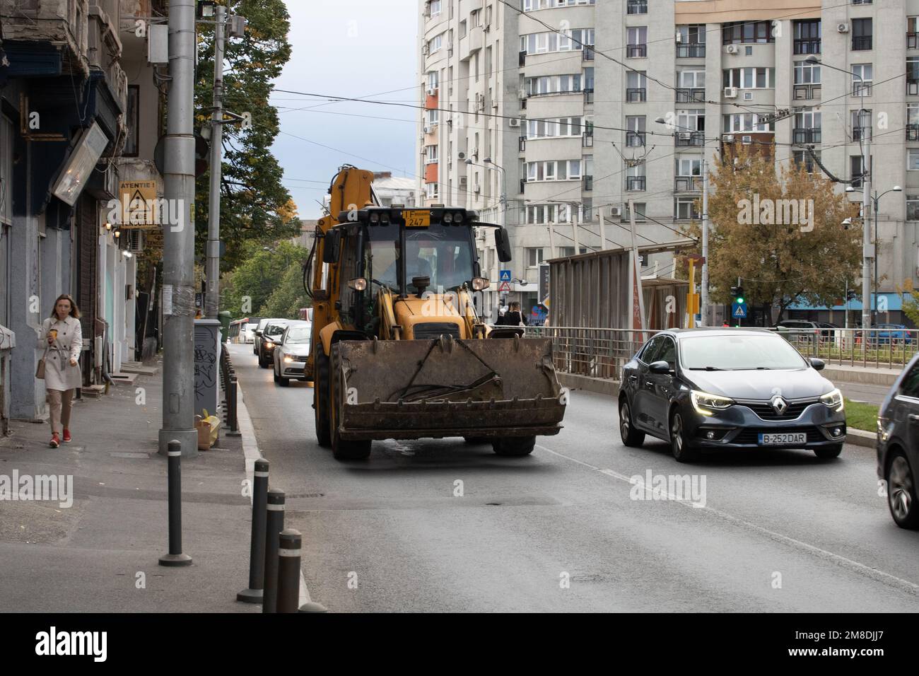 Construction workers at construction site and heavy duty bulldozer in ...