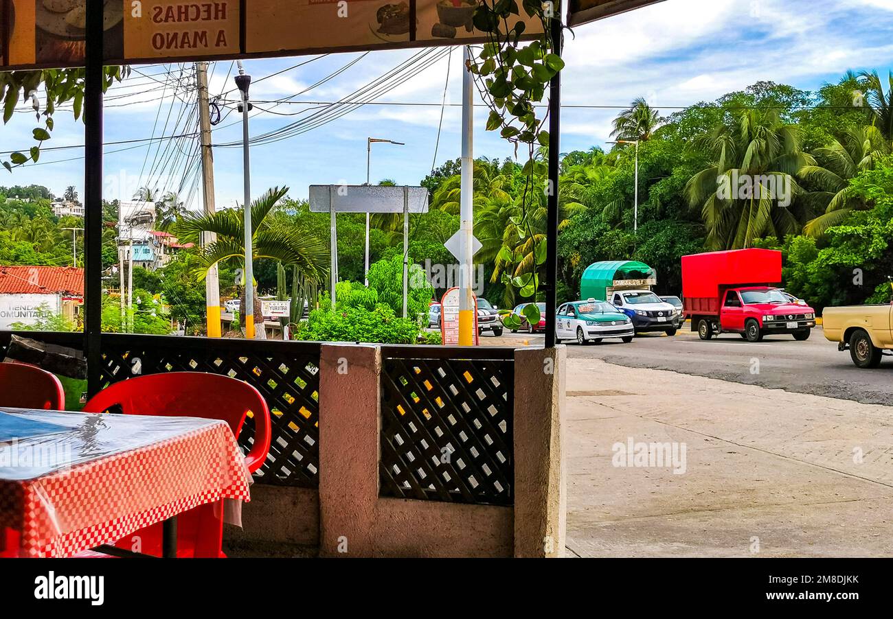 Colorful streets cars high traffic stores people buildings and trade in ...