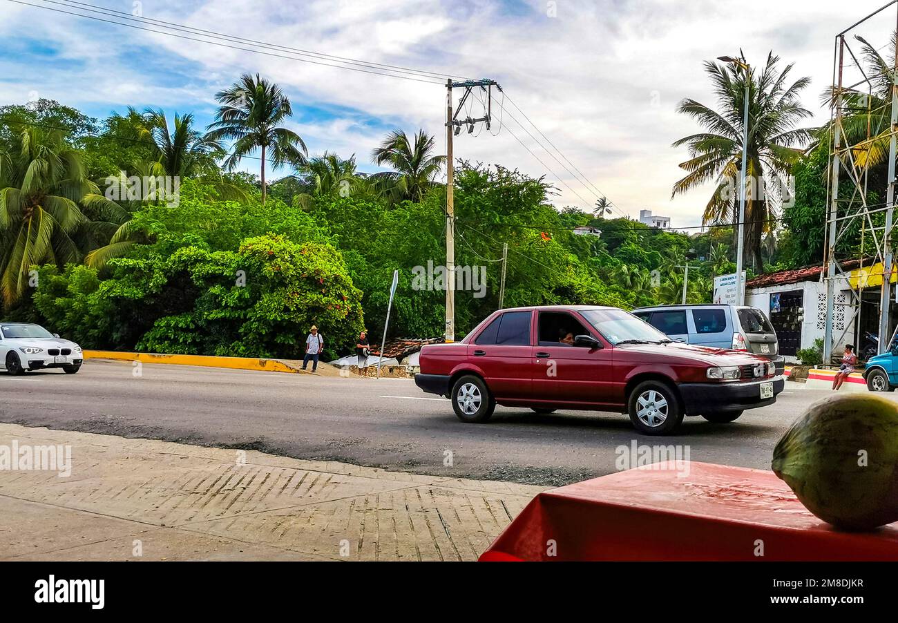 Colorful streets cars high traffic stores people buildings and trade in ...