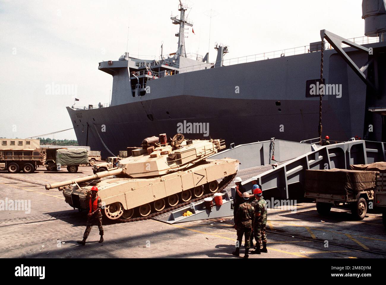 A U.S. Army M-1 Abrams main battle tank is loaded aboard the rapid ...