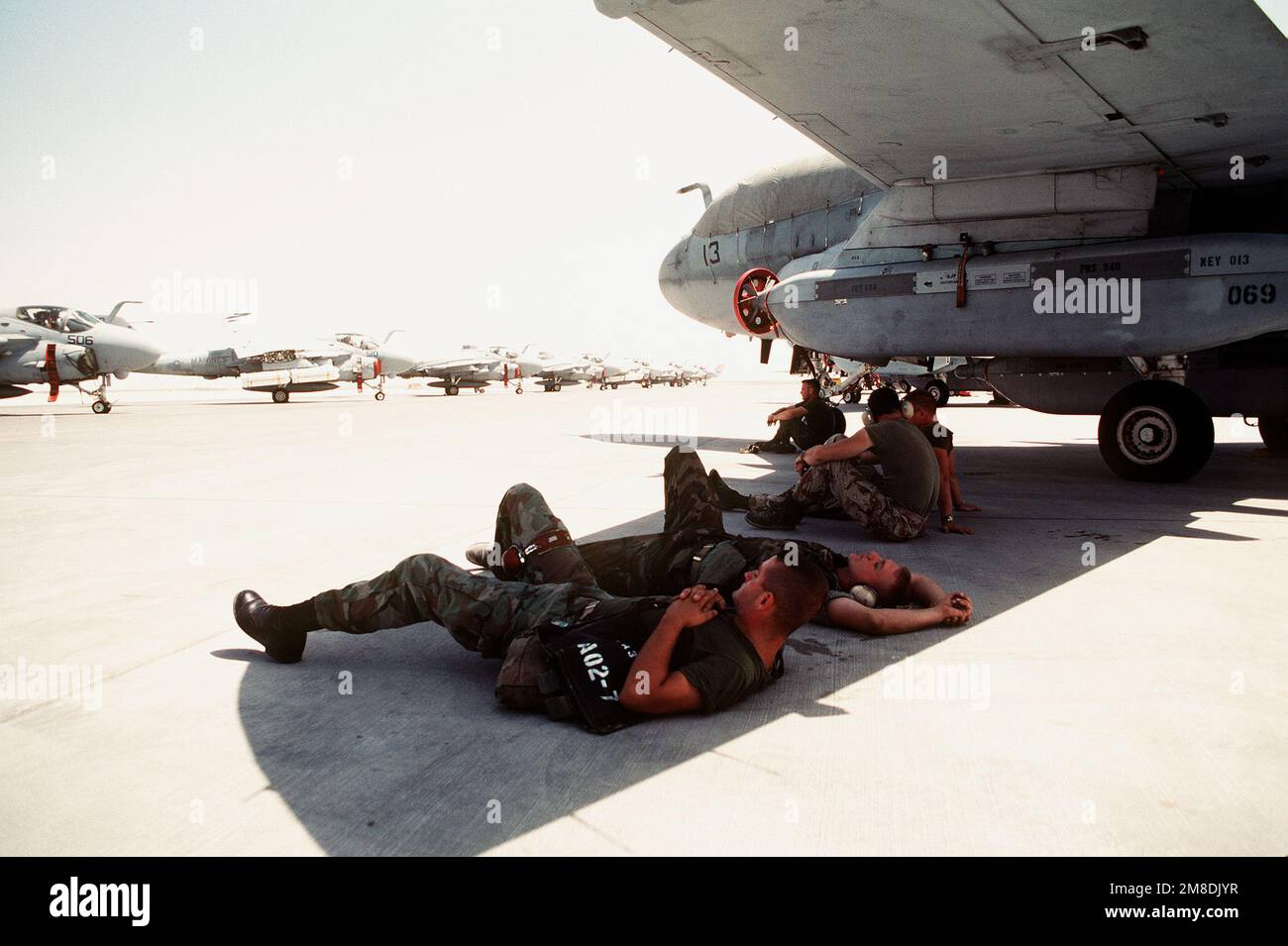 U.S. Marines, deployed to the region in support of Operation Desert Shield, take a break from ...