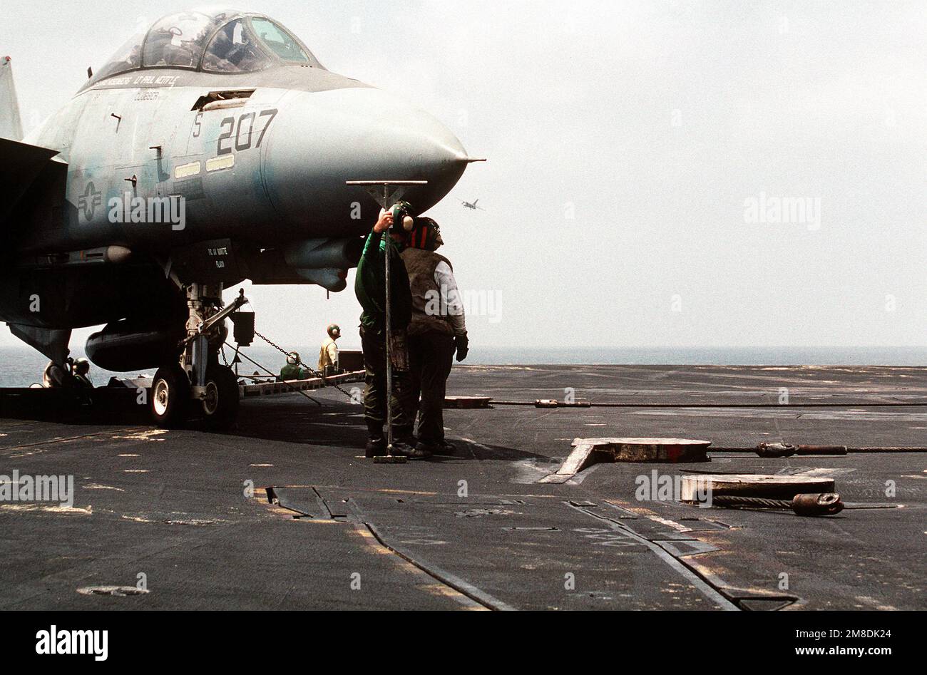 Flight deck crewmen aboard the aircraft carrier USS INDEPENDENCE (CV-62 ...