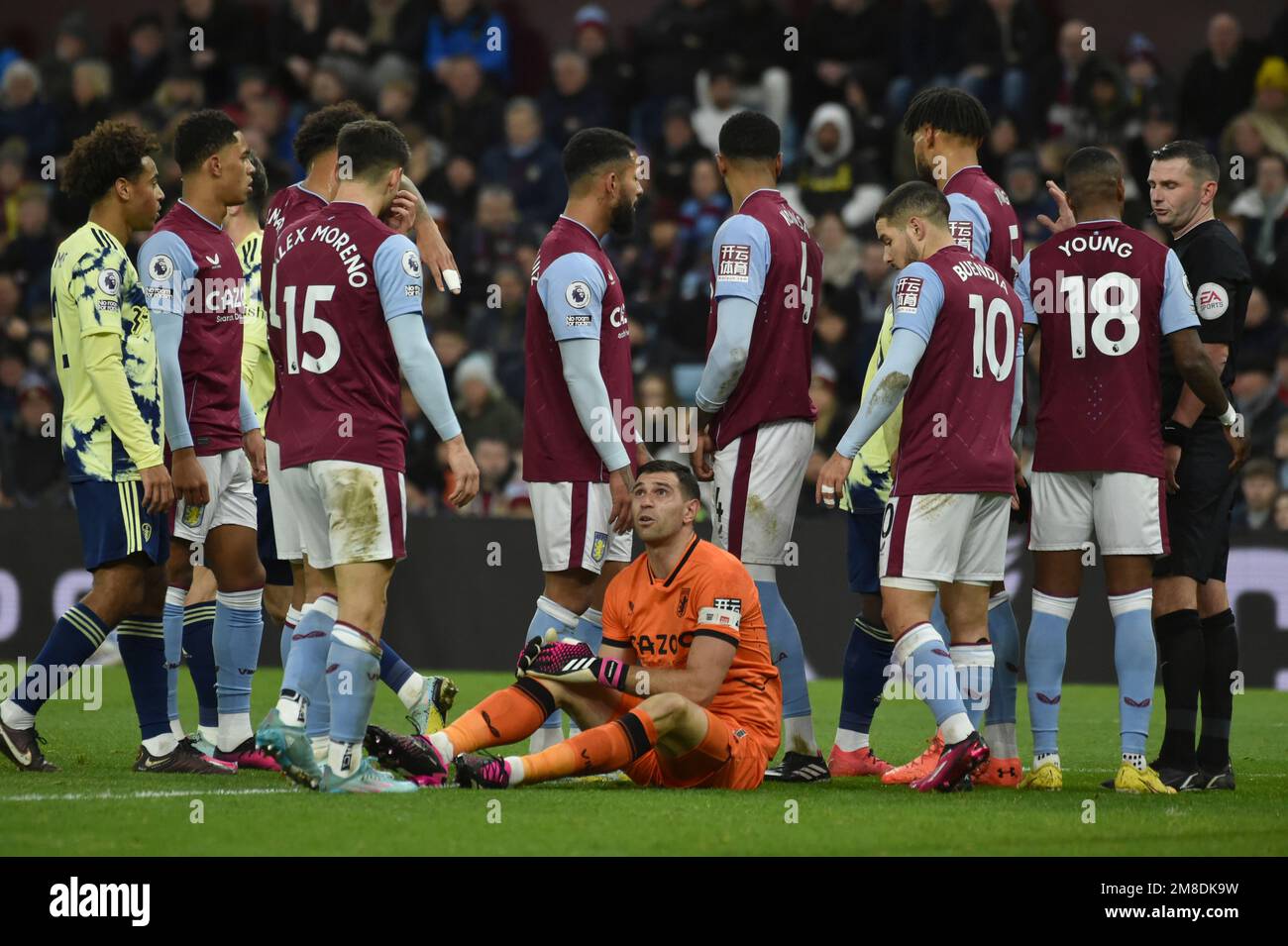 Aston Villa's goalkeeper Emiliano Martinez, sits on the ground and ...