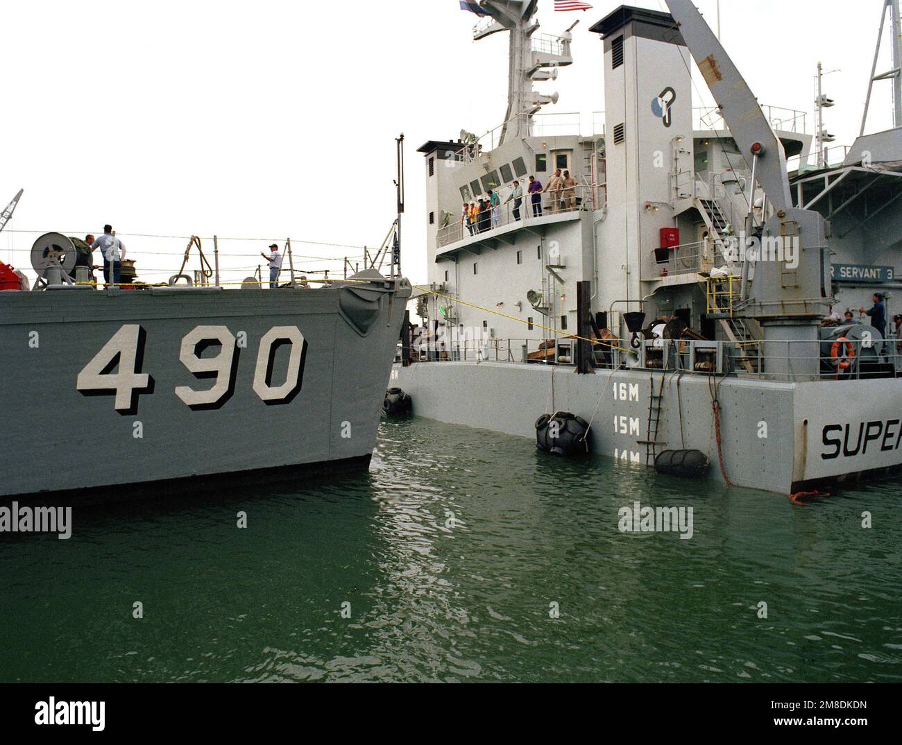 The ocean minesweeper USS LEADER (MSO-490) lies tied up over the ...