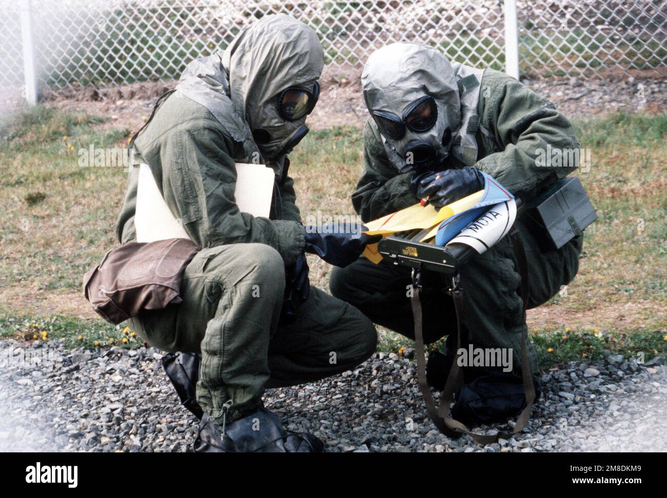 Soldiers wearing nuclear-biological-chemical (NBC) protective suits and ...