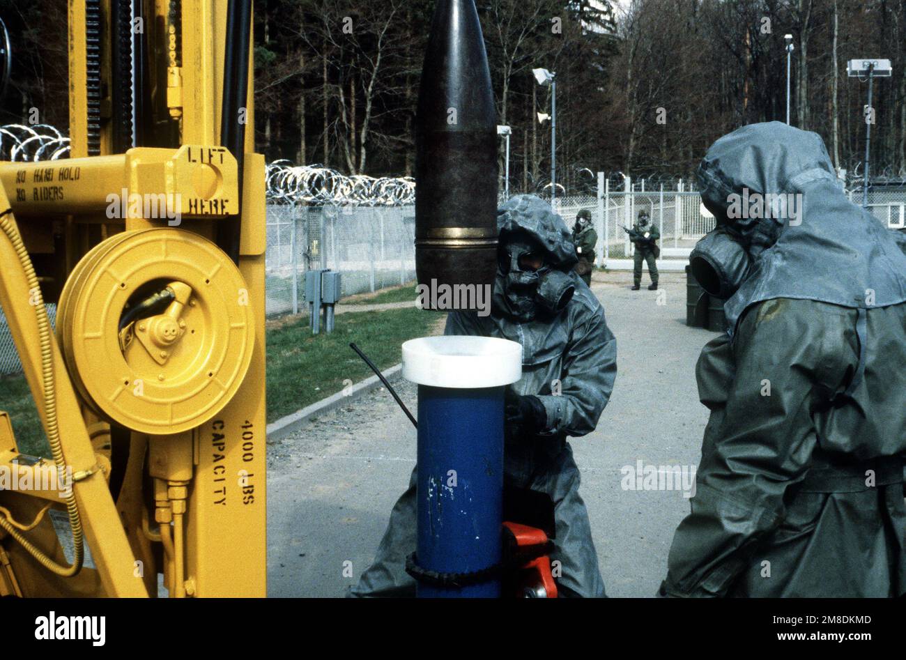 A soldier wearing nuclear-biological-chemical (NBC) protective suit and ...