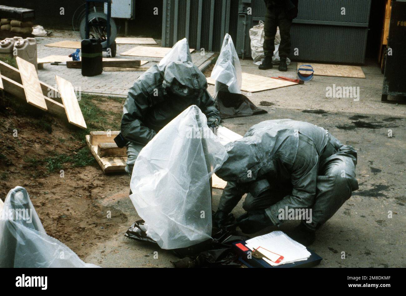 Soldiers wearing nuclear-biological-chemical (NBC) protective suits and ...