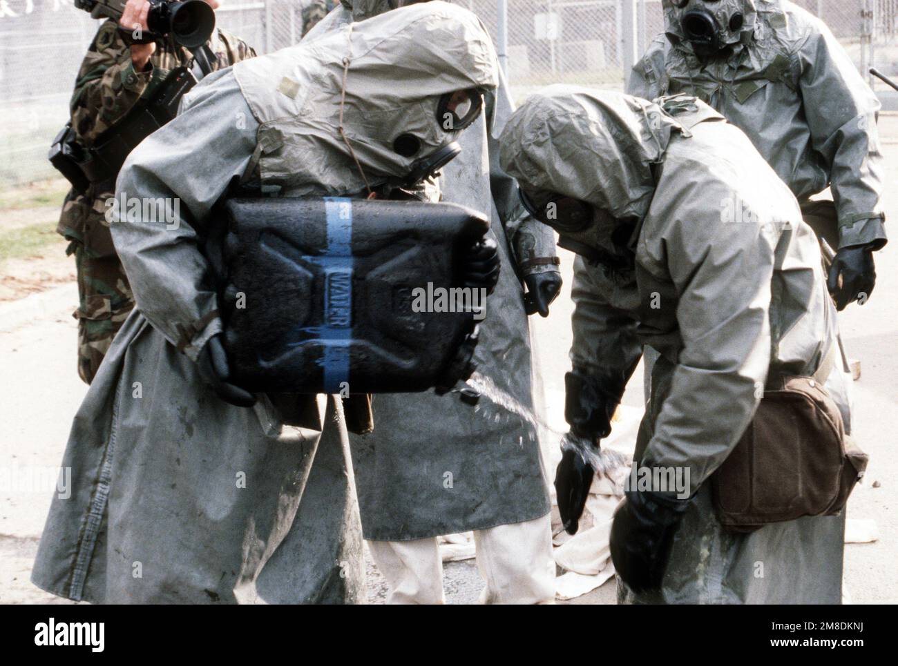 Soldiers wearing nuclear-biological-chemical (NBC) protective suits and ...