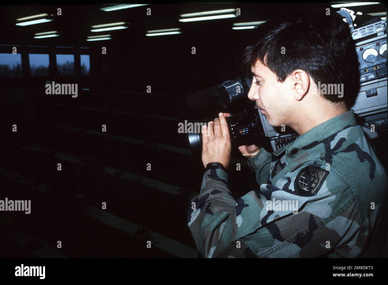 An Army video cameraman films a planning conference for Operation ...