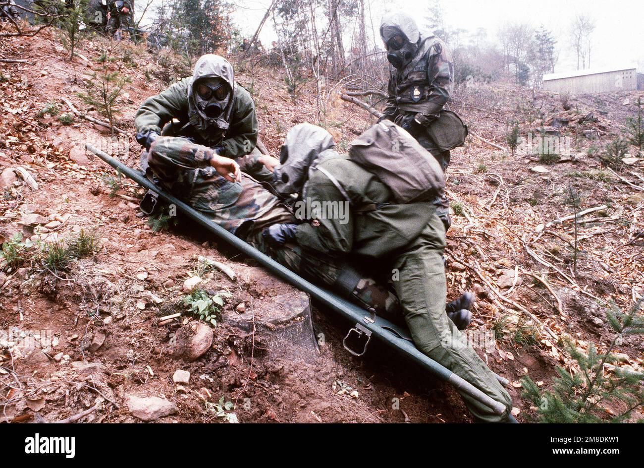 Medical team personnel wearing nuclear-biological-chemical (NBC ...