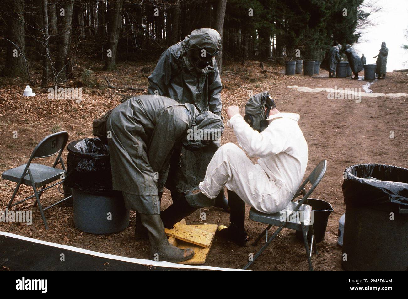 A soldier wearing a nuclear-biological-chemical (NBC) protective suit ...