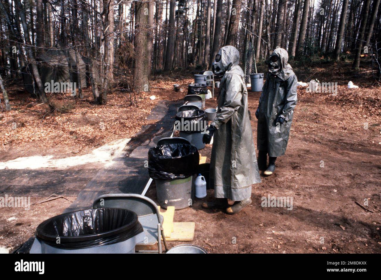 Soldiers wearing nuclear-biological-chemical (NBC) protective suits and ...