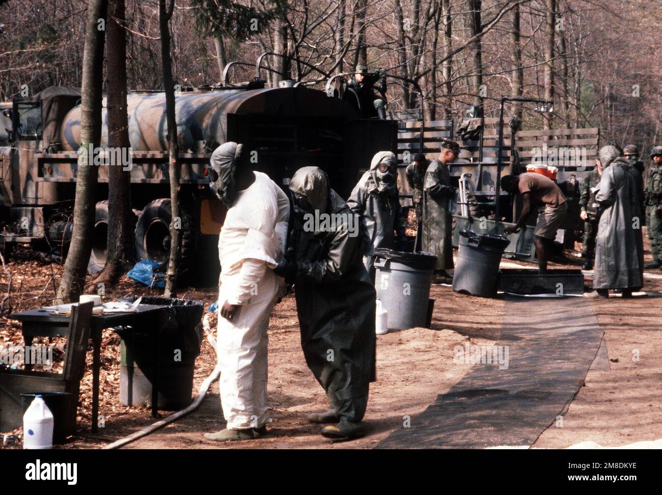 A soldier wearing a nuclear-biological-chemical (NBC) protective suit ...