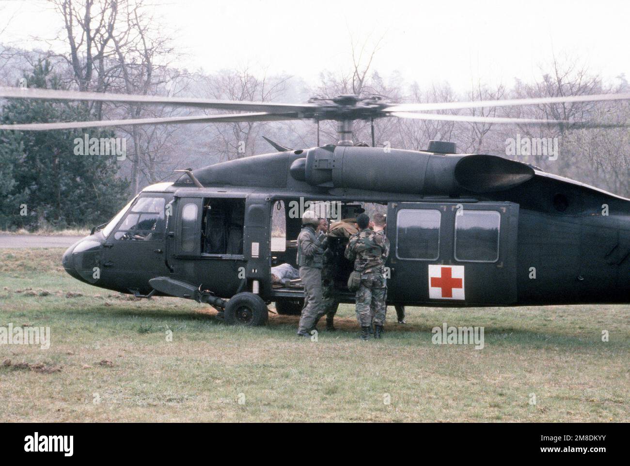 A simulated casualty is loaded into a UH-60A Black Hawk (Blackhawk ...