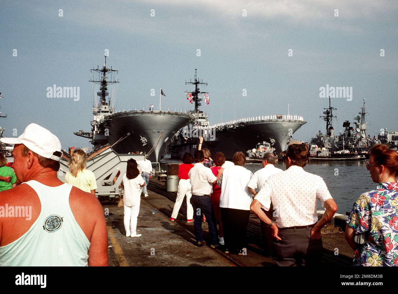 Family members and friends of crew members aboard the amphibious ...
