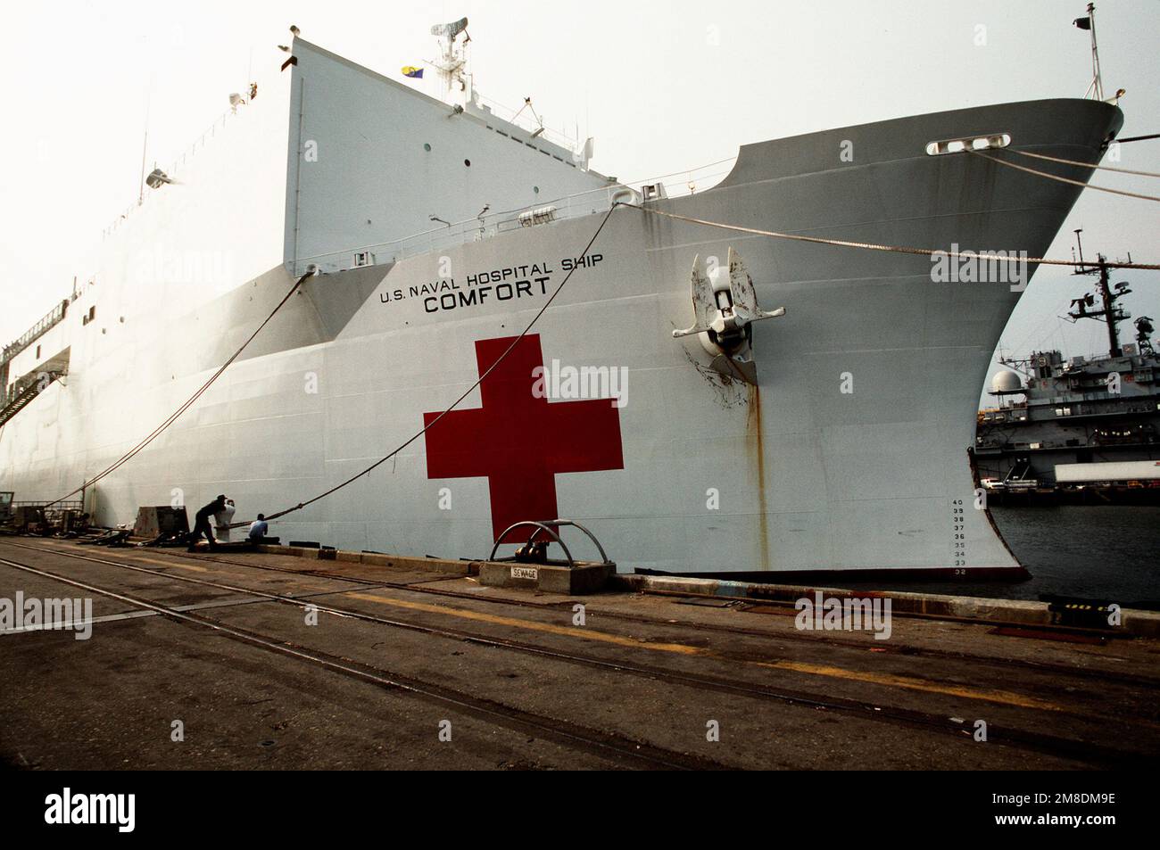 The hospital ship USNS COMFORT (T-AH-20) is moored to a pier prior to ...