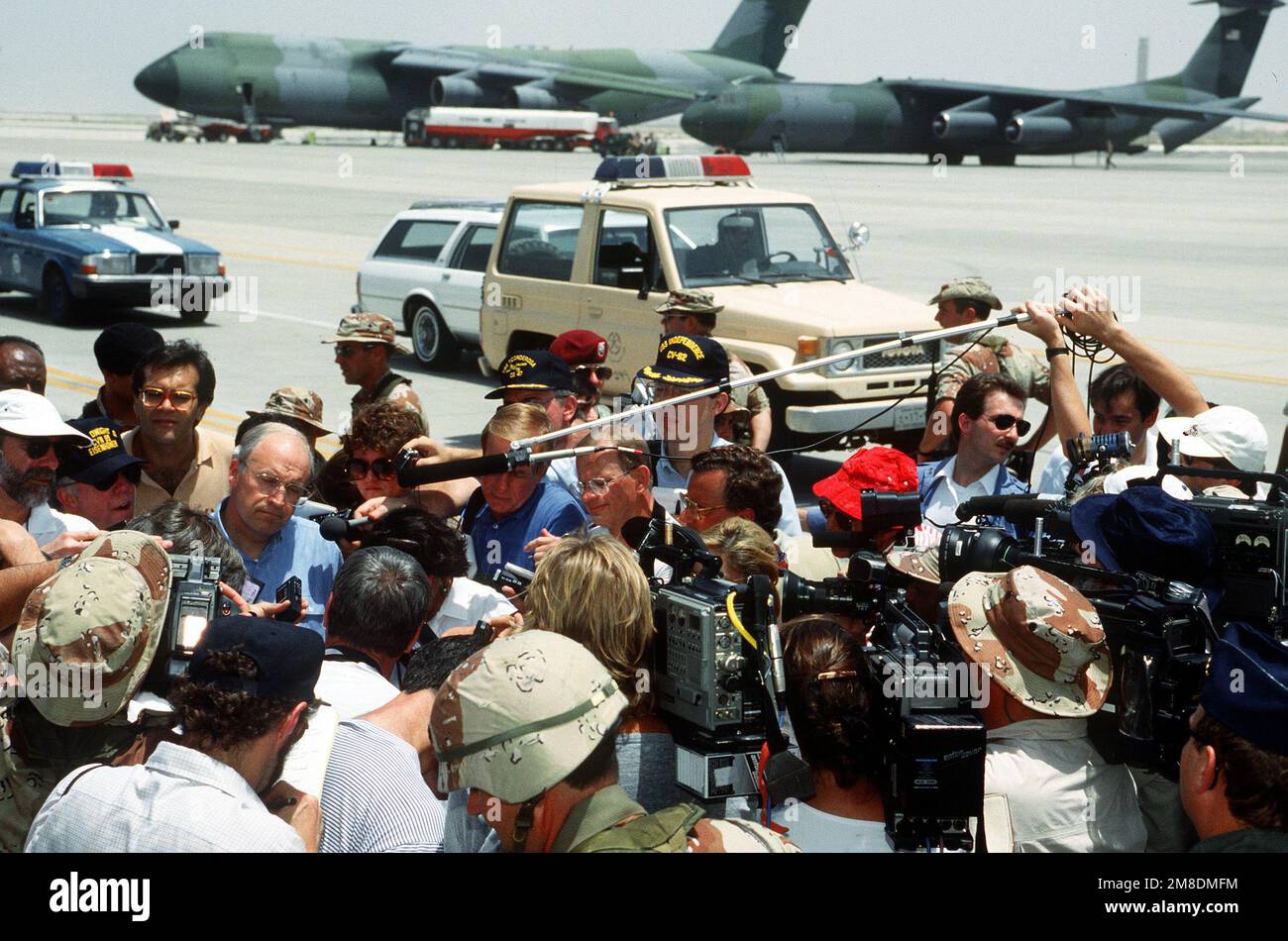 Members of the media interview Secretary of Defense Richard Cheney upon ...