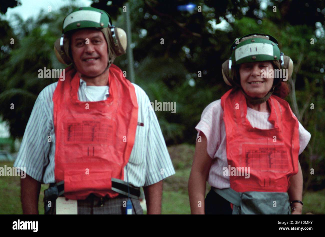 A couple waits to board a helicopter on the grounds of the U.S. Embassy ...