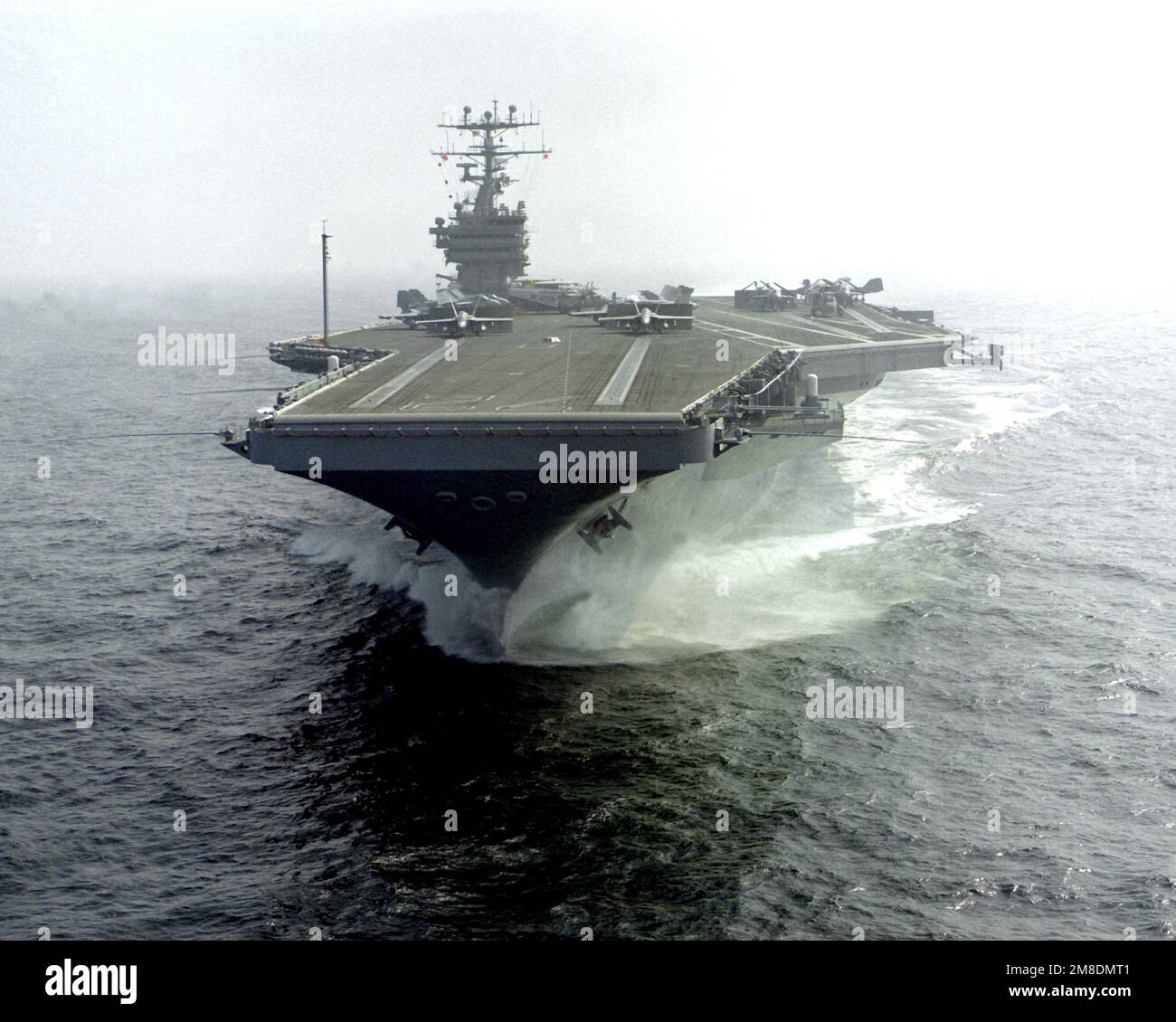 A bow view of the nuclear-powered aircraft carrier USS ABRAHAM LINCOLN ...