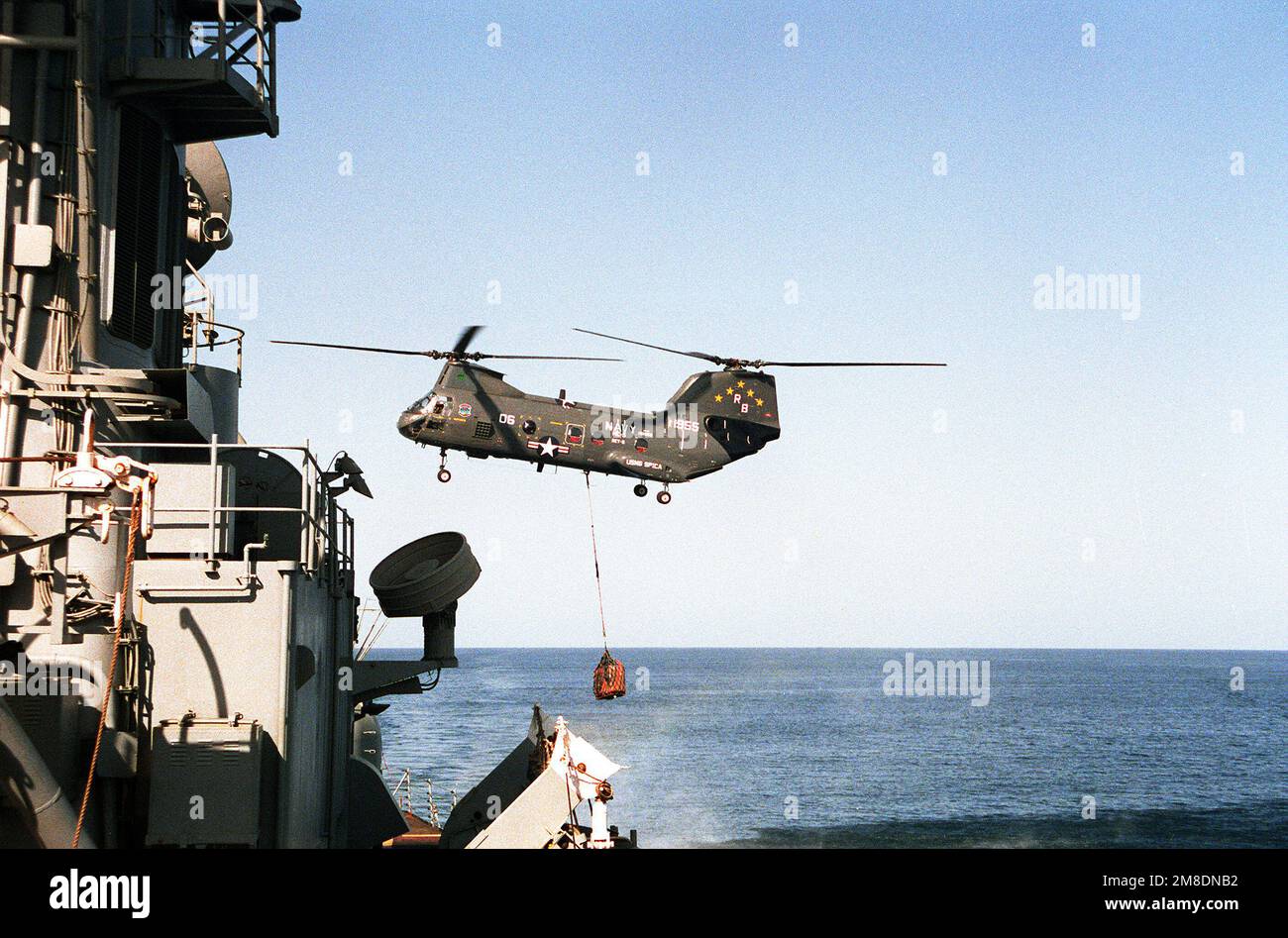 During vertical replenishment, an HH-46 Sea Knight helicopter of ...