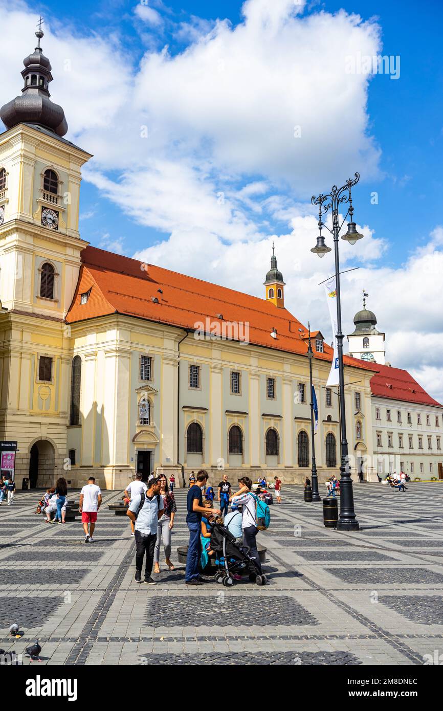 People and tourists wandering on the streets of old town Sibiu, Romania ...